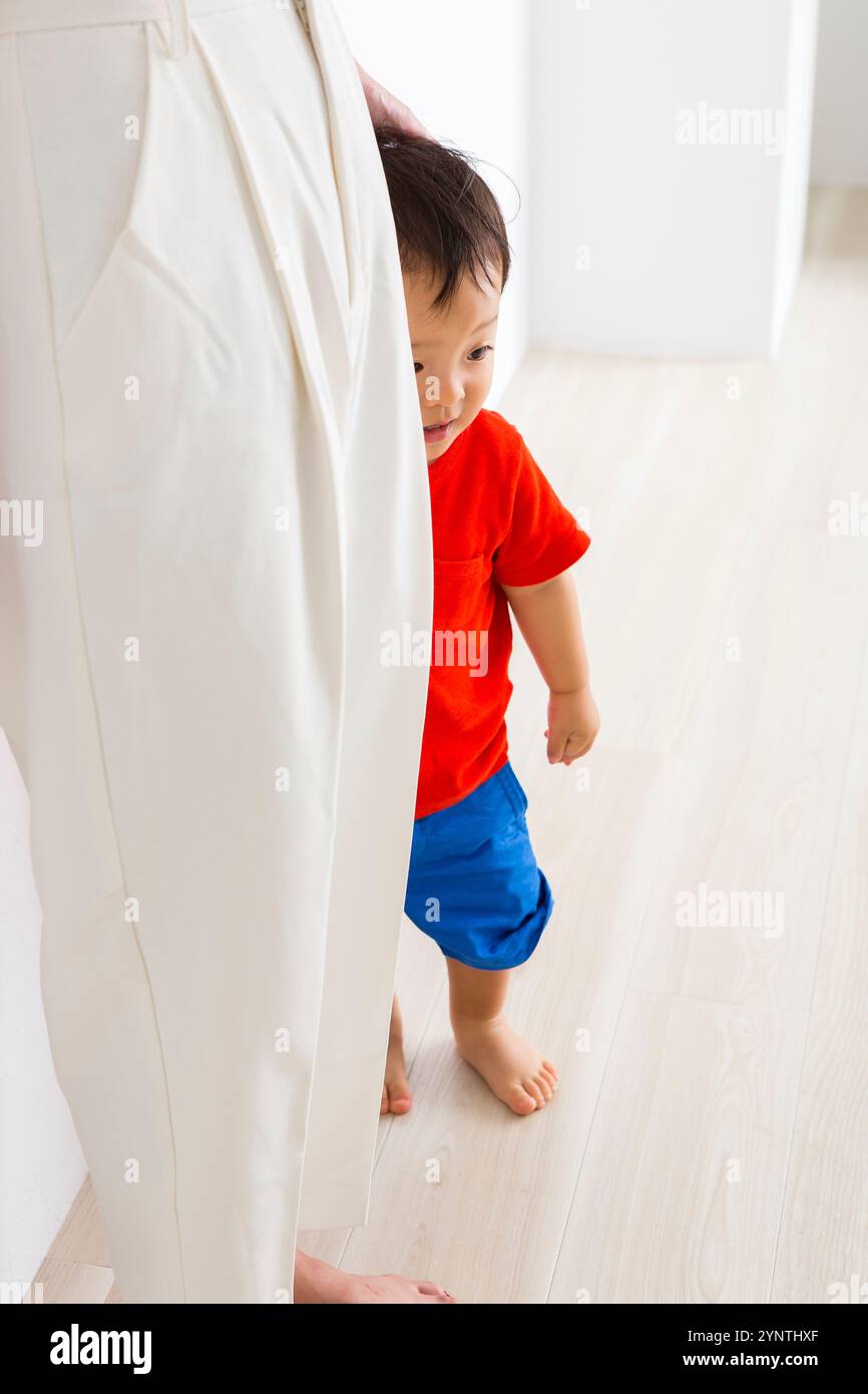 Child cuddling up to her mother Stock Photo - Alamy