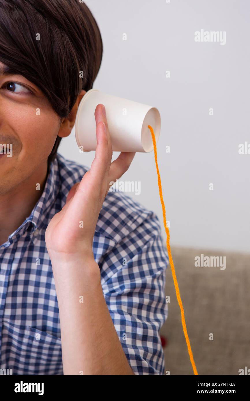 Tin can telephone couple hi-res stock photography and images - Alamy