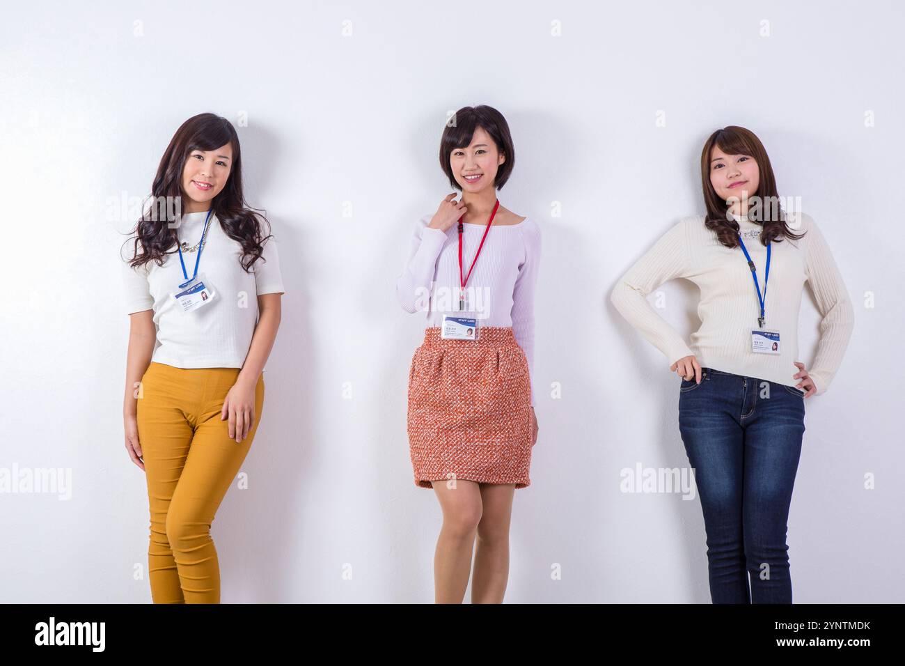 Women wearing employee ID cards Stock Photo - Alamy