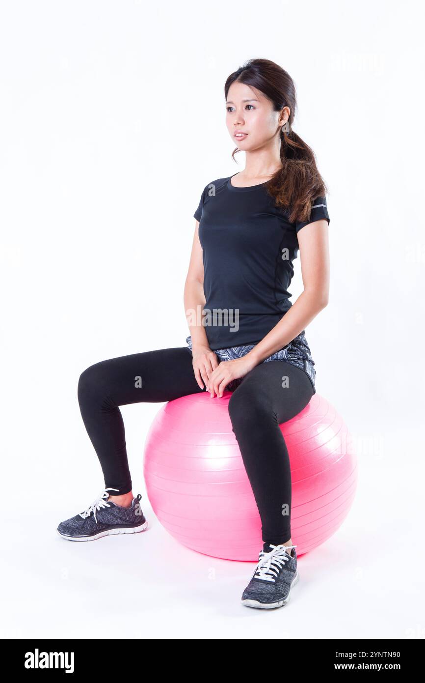 Woman in gym ball Cut Out Stock Images & Pictures - Alamy
