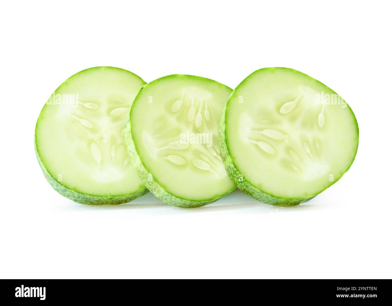 Side view of fresh green cucumber slices in circle shape in stack is ...