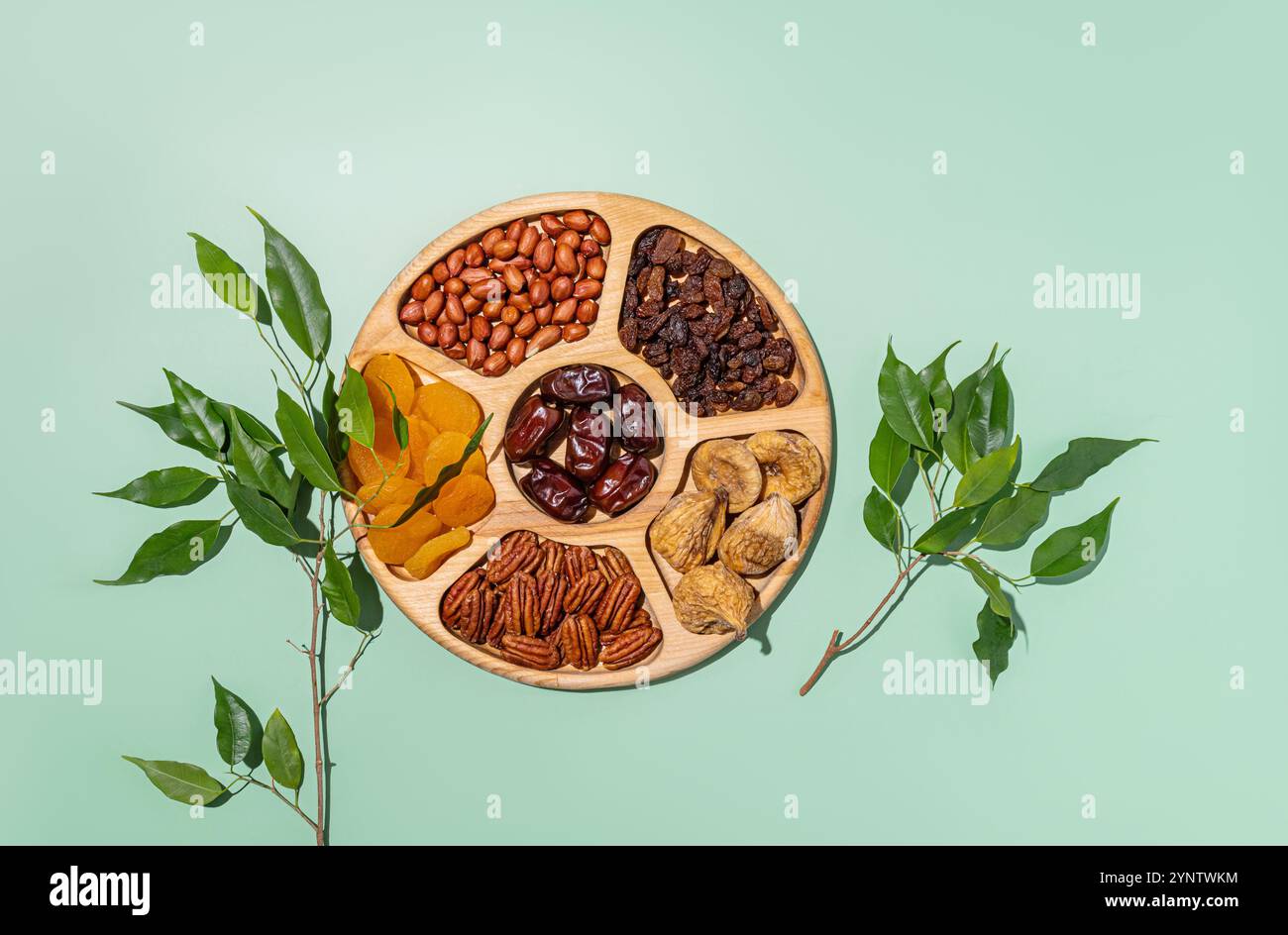 A large wooden manege with a mix of dried fruits and nuts among the ...