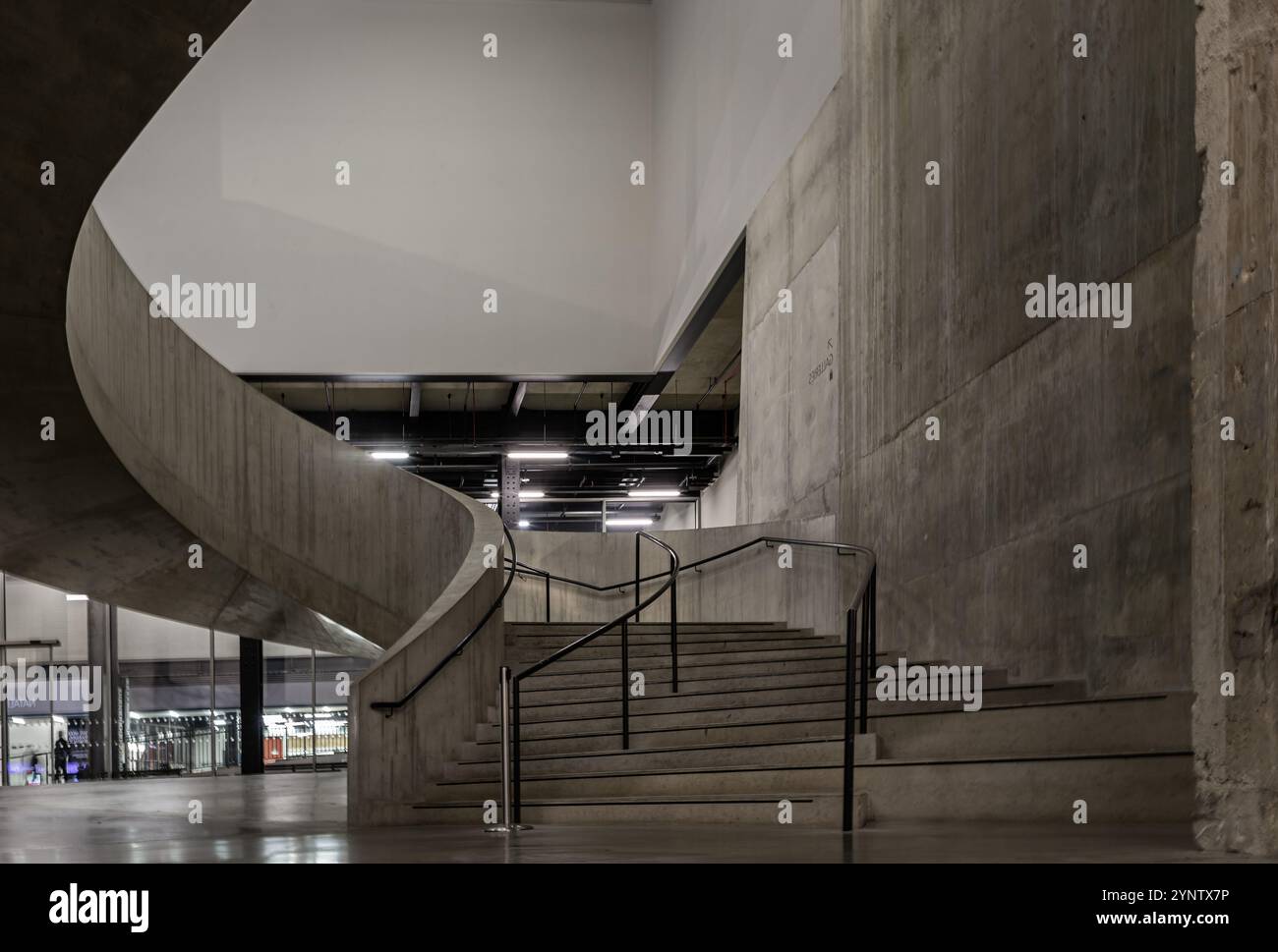London, UK - Nov 07, 2023 - A curving flight concrete spiral staircase ...