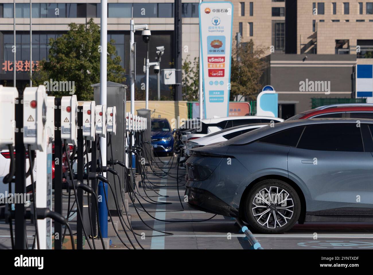 Electric vehicle charging stations are seen in Beijing, Friday, Oct. 11 ...