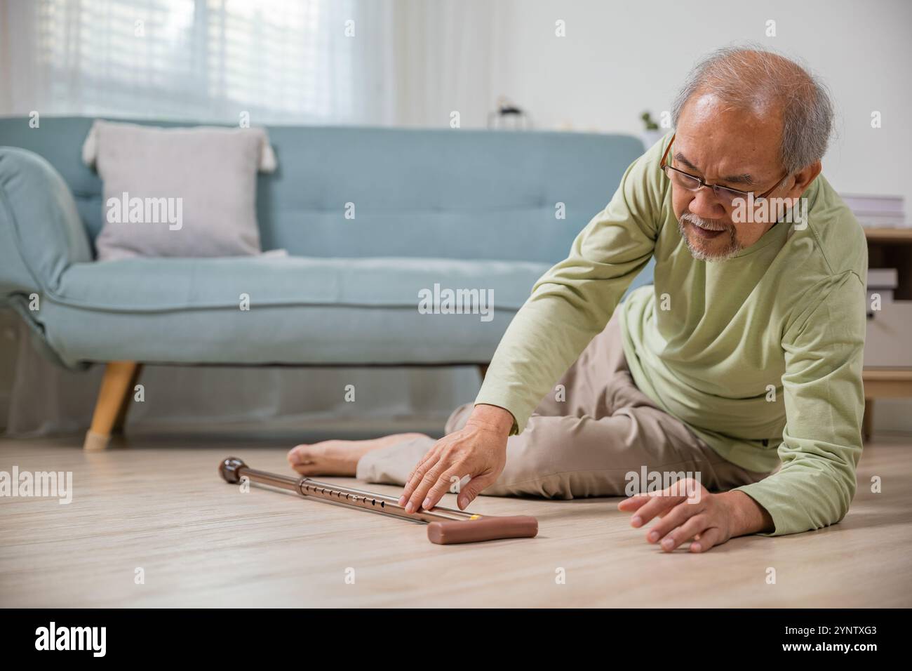 Sick senior old man falling down lying on floor because stumbled at ...