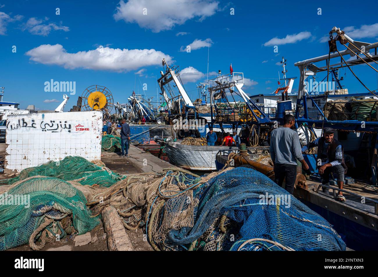 Sfax, Tunisia - November 12, 2024: Men working in the largest fishing port in Tunisia Stock ...