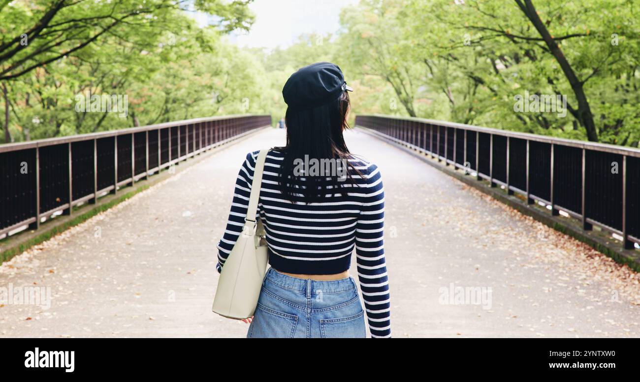 Travel, back and person on vacation, bridge and adventure for tourist ...