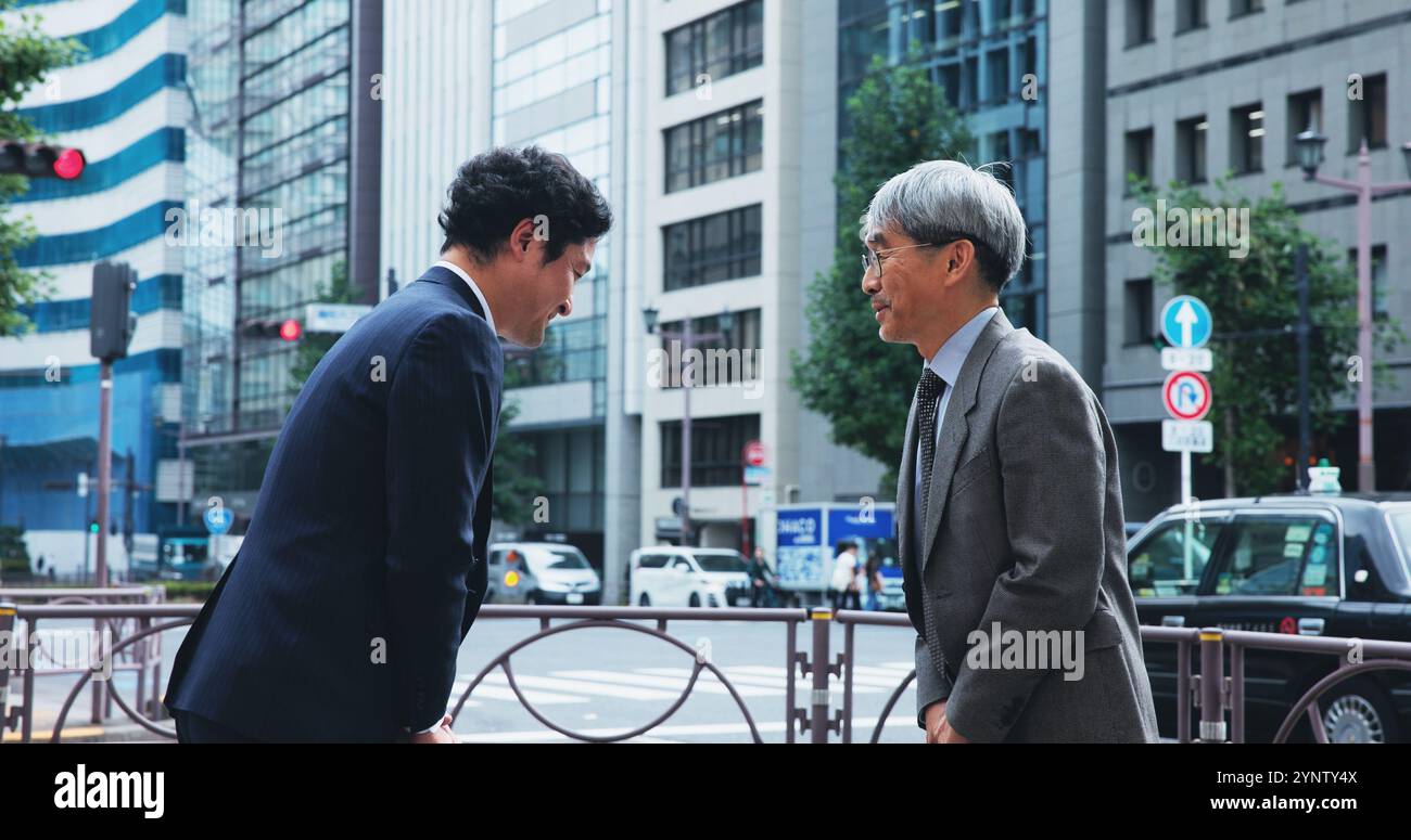 Bow, greeting and Japanese businessmen in city with cultural respect ...
