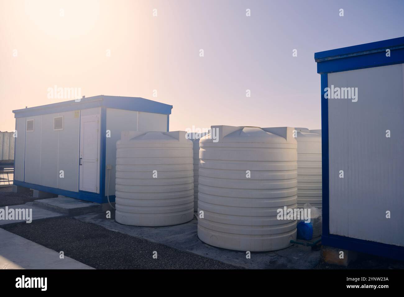 Water storage tanks and prefabricated industrial toilet cabins Stock ...