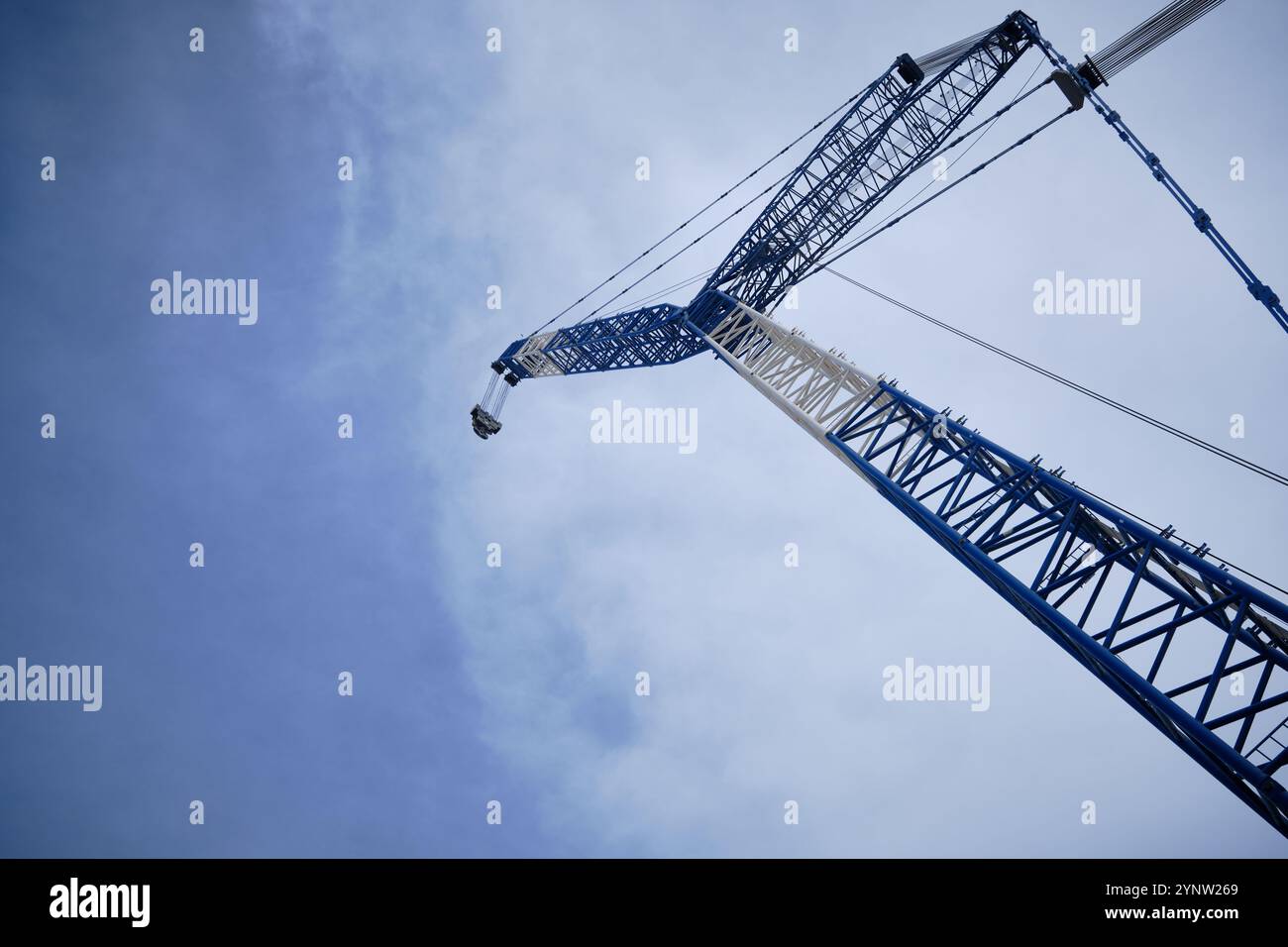 Crane boom opposite sky Stock Photo - Alamy