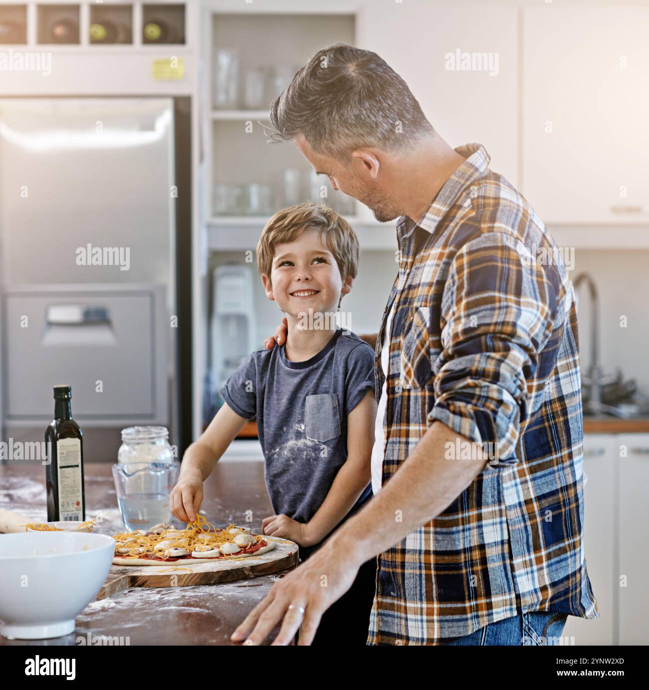 Happy, dad and cooking with child, pizza and meal prep with son in ...