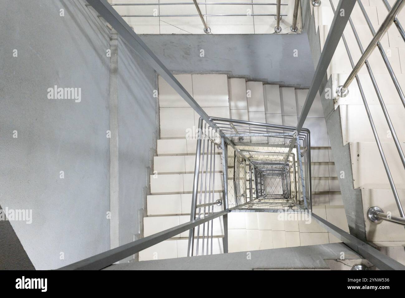 Generic modern square staircase shaft with steel net for fall safety ...