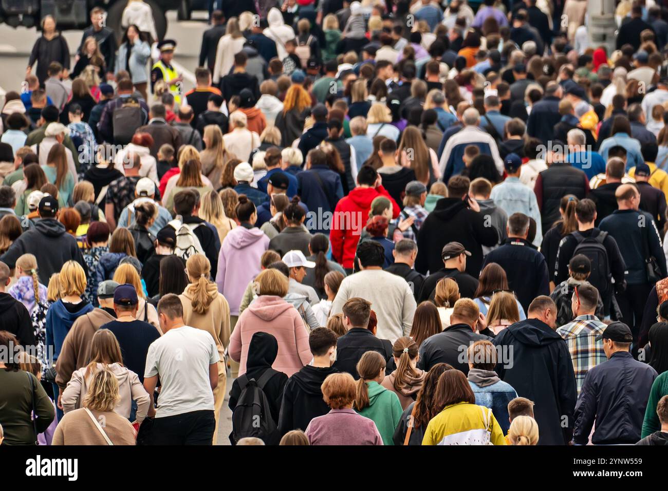 lots of people outside in the open air. a background of unrecognizable ...