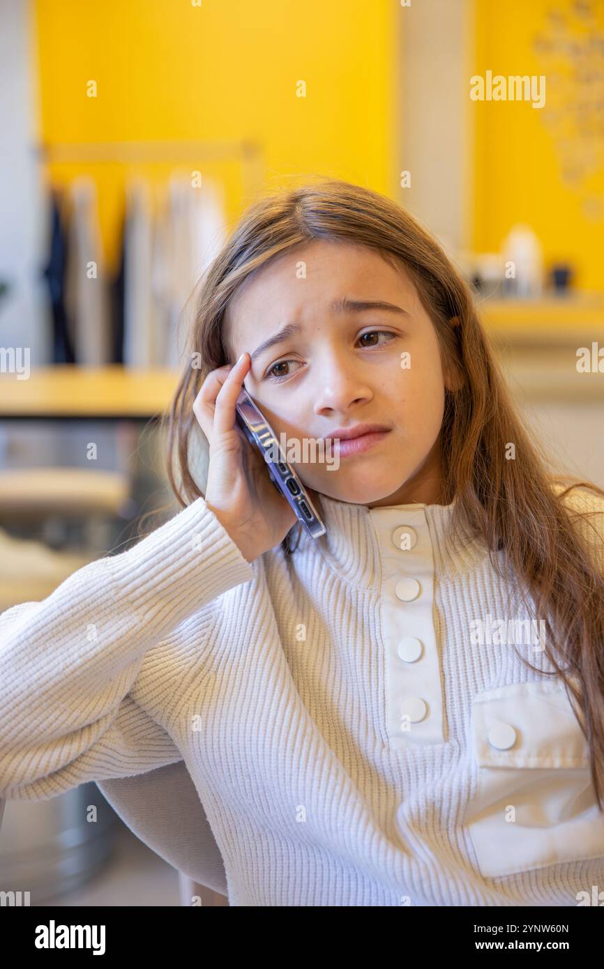 Sad girl talking on the phone. A girl with a phone Stock Photo - Alamy