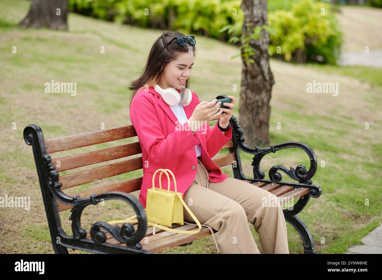 Woman using gadget sitting hi-res stock photography and images - Alamy