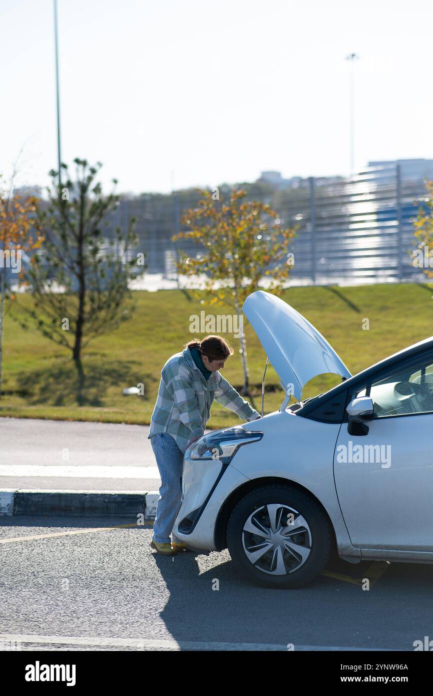Upset woman looks broken auto hi-res stock photography and images - Alamy