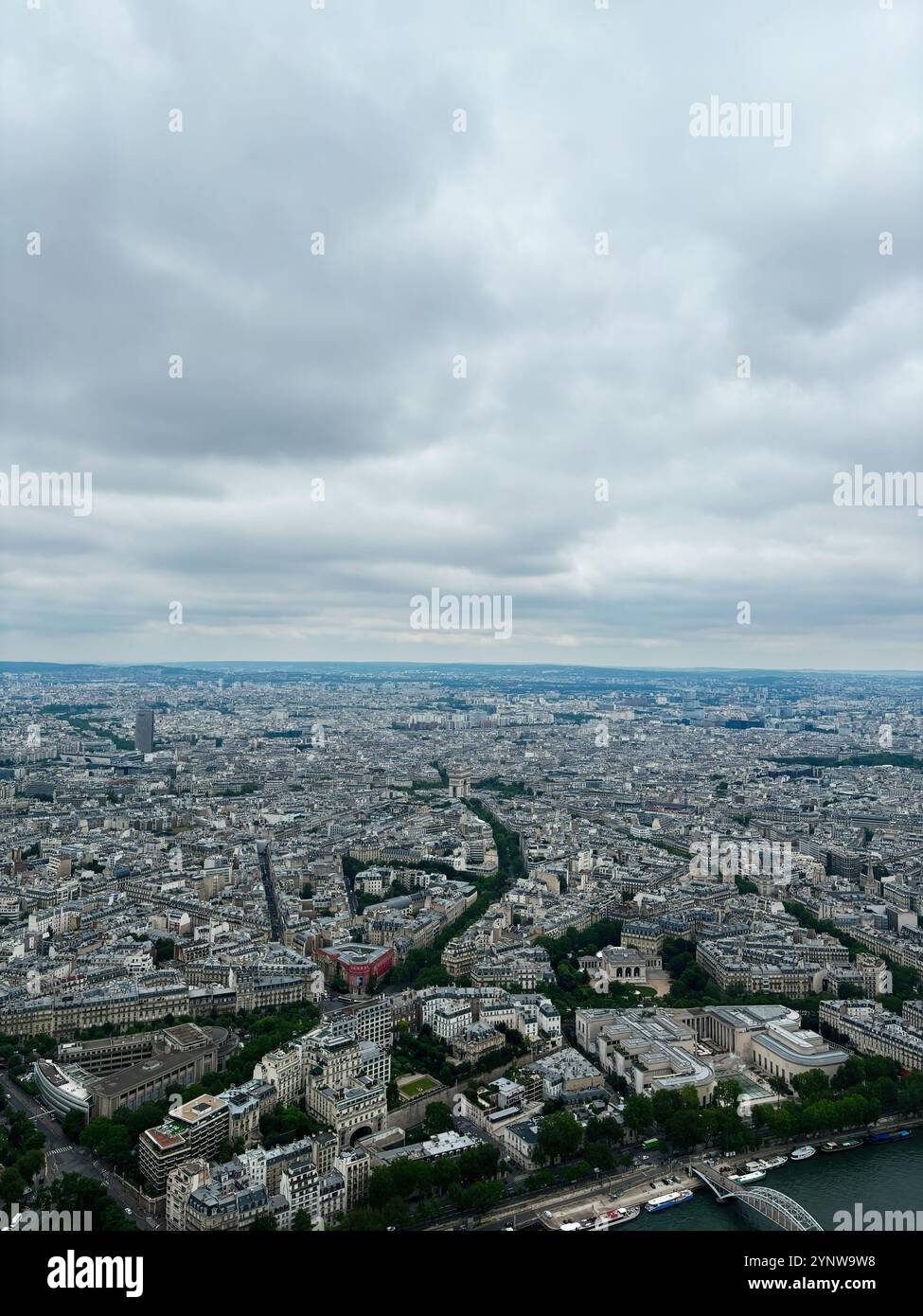 A breathtaking panoramic view of the Paris skyline under an overcast ...