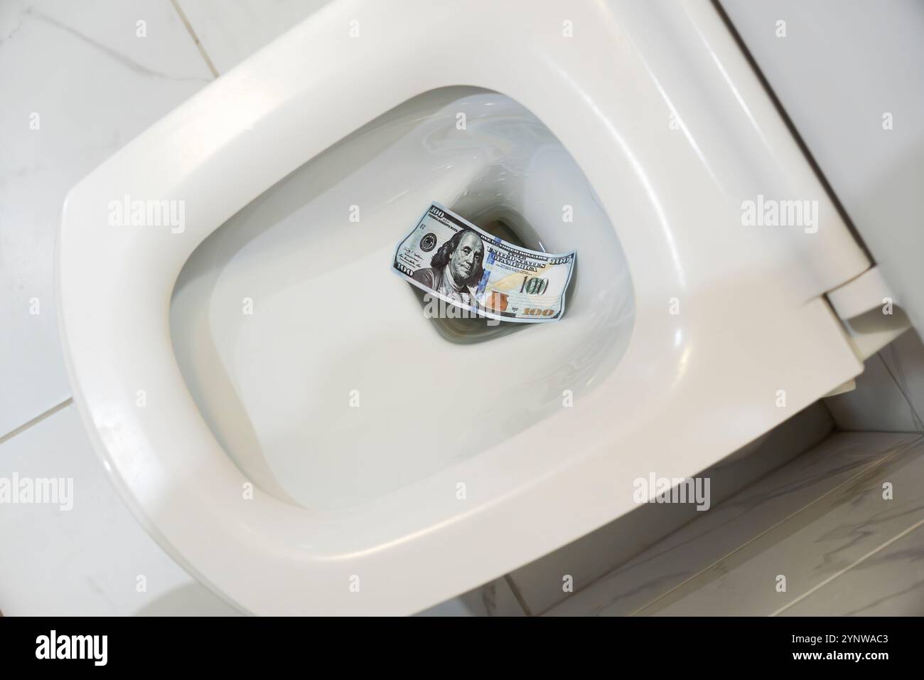 Flush money down the toilet hi-res stock photography and images - Alamy