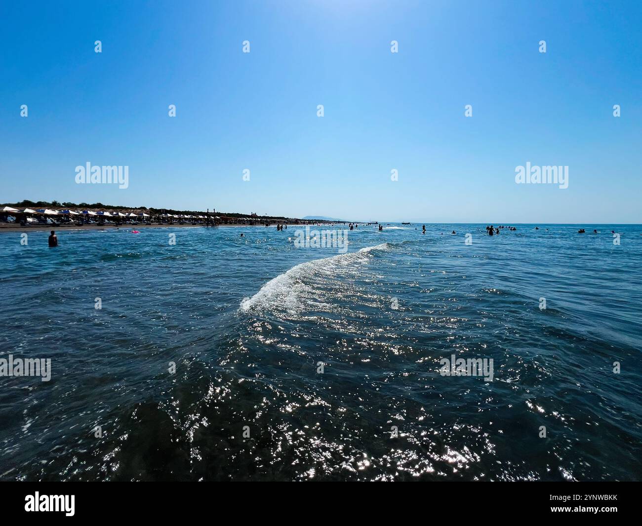 Sunny beach scene crowd people enjoying shore hi-res stock photography ...