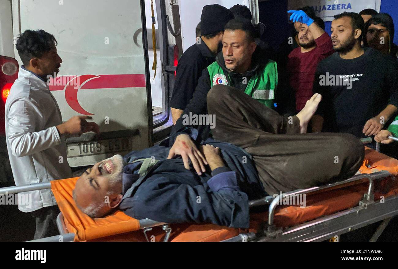 People carry the bodies of Palestinians, who killed in Israeli strikes ...