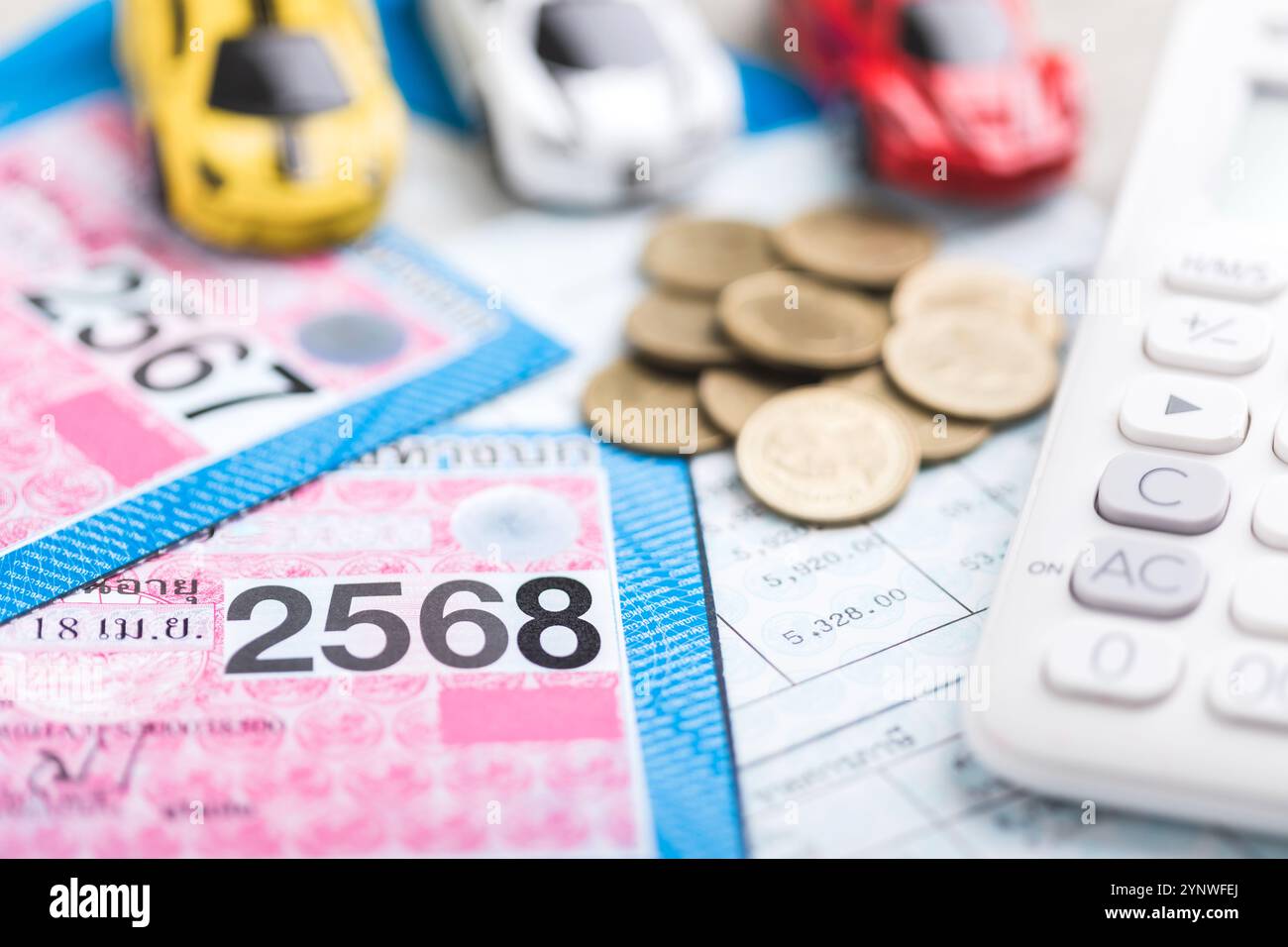 Close-up of Thailand's 2025 vehicle tax sticker placed beside a ...
