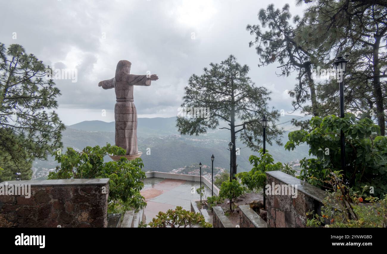 A majestic Christ statue stands with arms outstretched in Taxco de ...