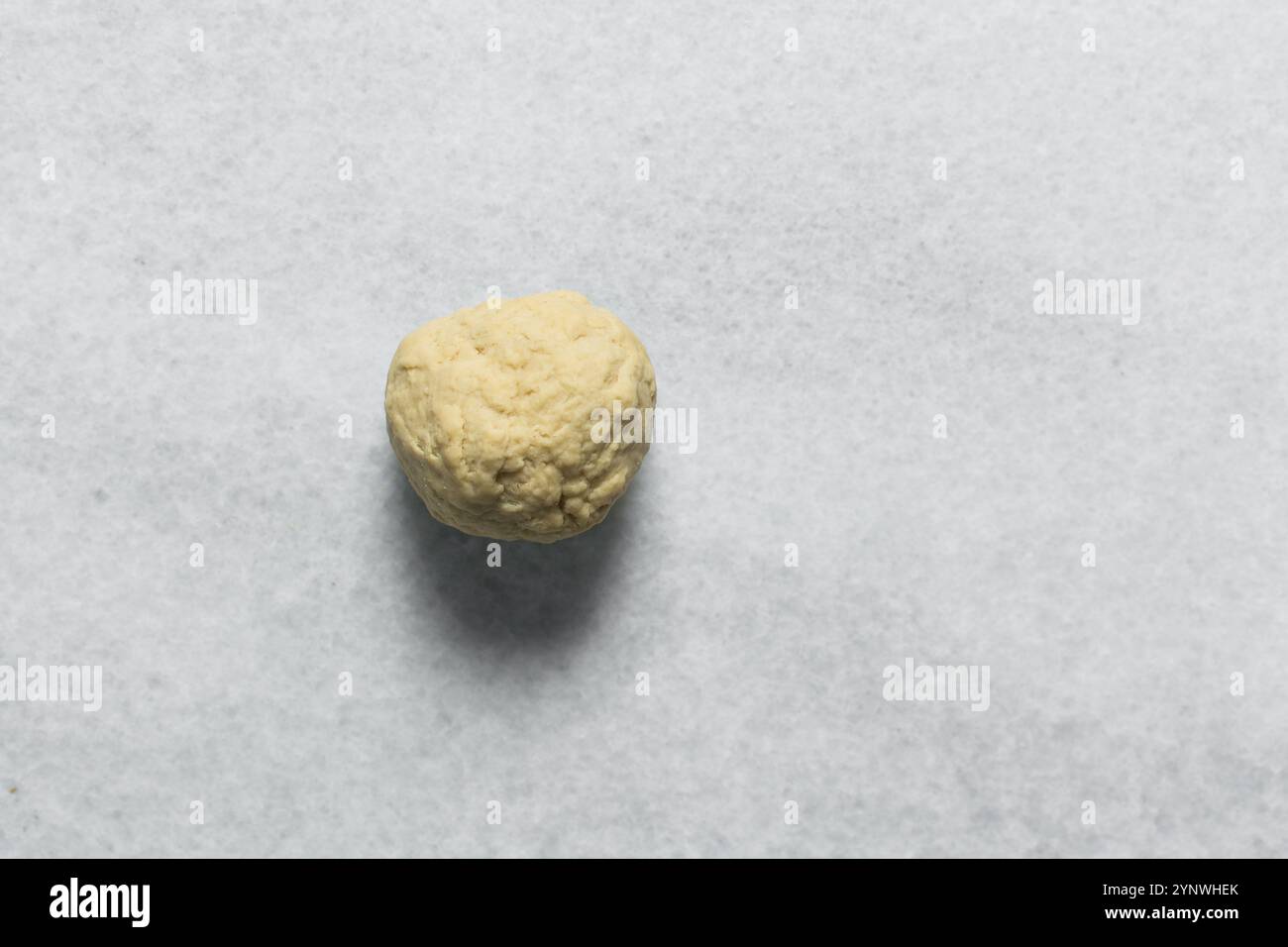 Overhead view of homemade pasta dough, top view pasta dough on a white ...