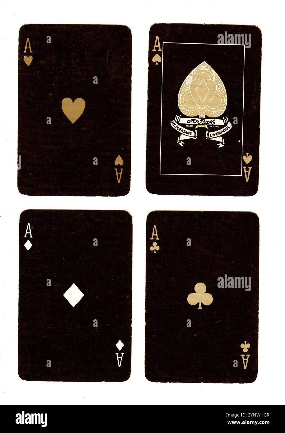 Vintage playing cards in gold and black showing four aces on a white ...