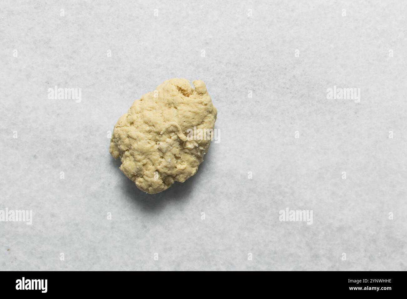 Overhead view of homemade pasta dough, top view pasta dough on a white ...