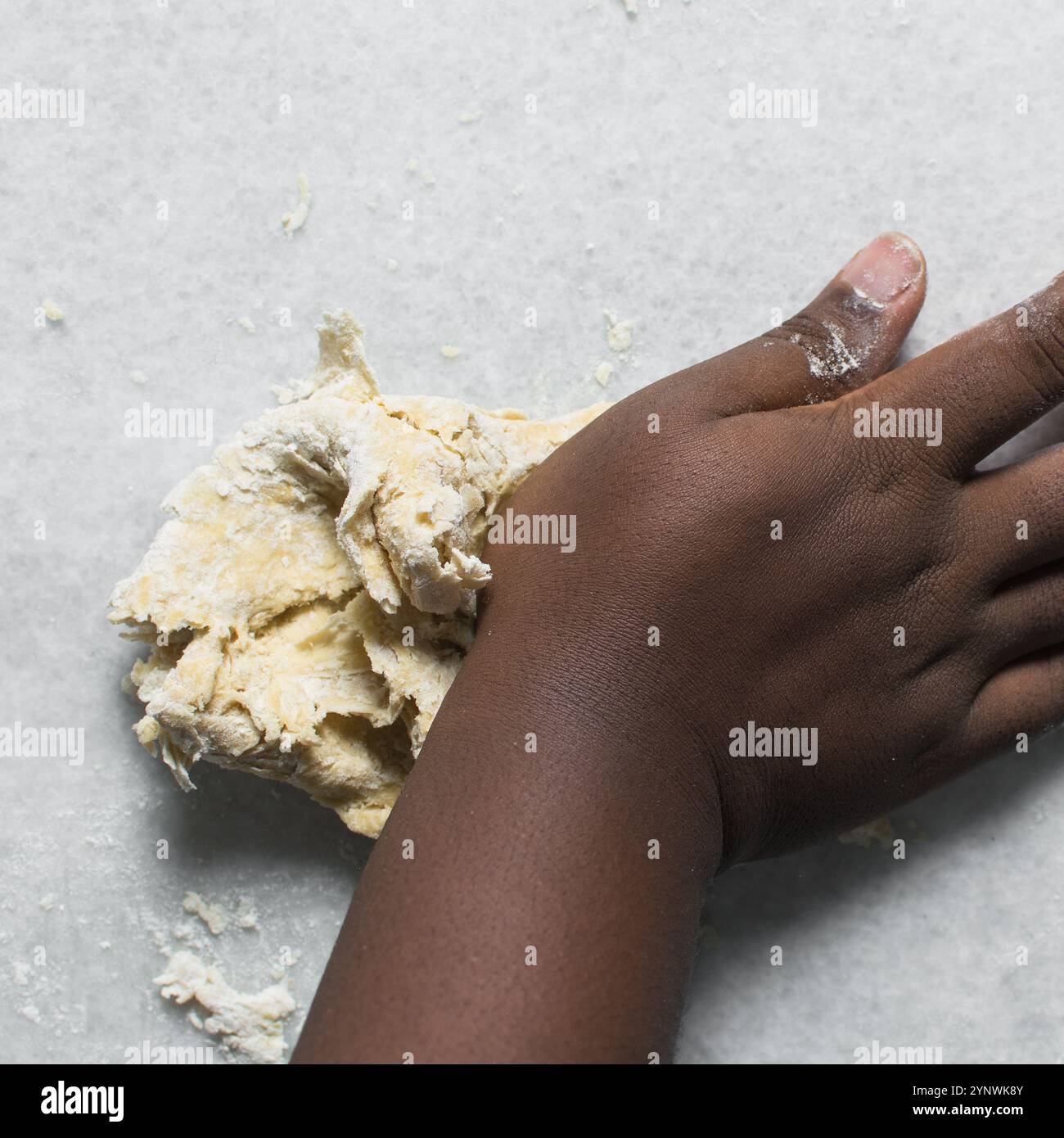Overhead view of hand Kneading pasta dough, top view pasta dough being ...