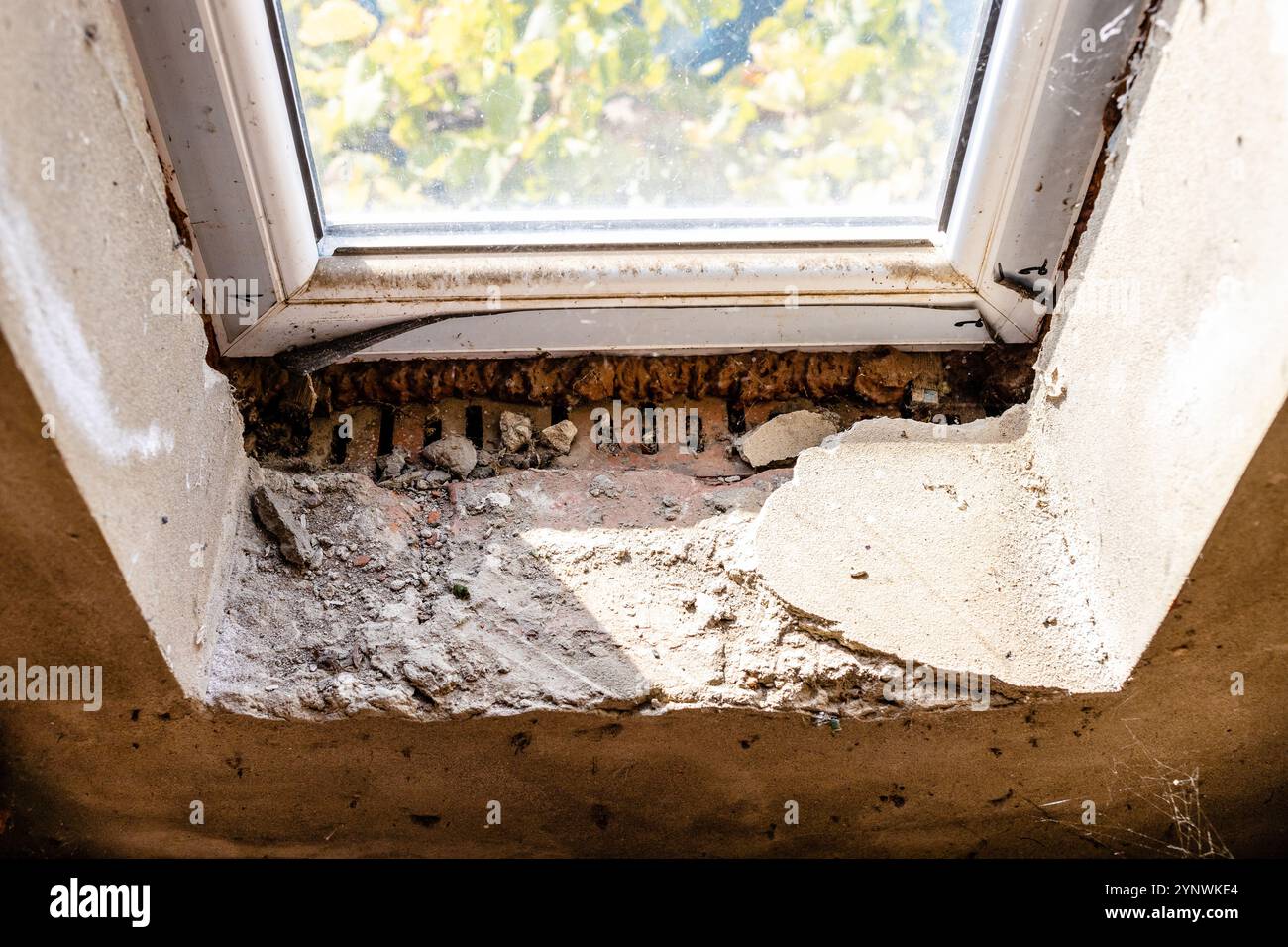 old broken window slope and sill after installing plastic window frame ...