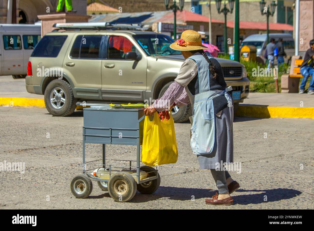 Old woman pushing trolley in hi-res stock photography and images - Alamy
