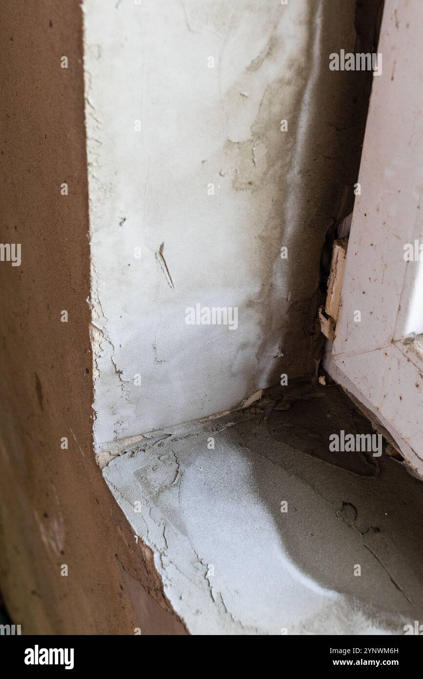 first layers of fresh plaster in corner of window sill close up Stock ...