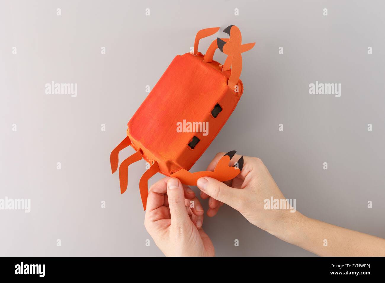 a fun craft project crab creation is made from an orange-painted egg ...