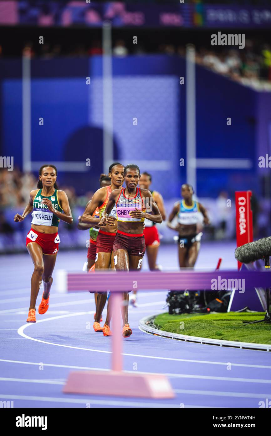 Peruth Chemutai participating in the 3000 metres steeplechase at the ...