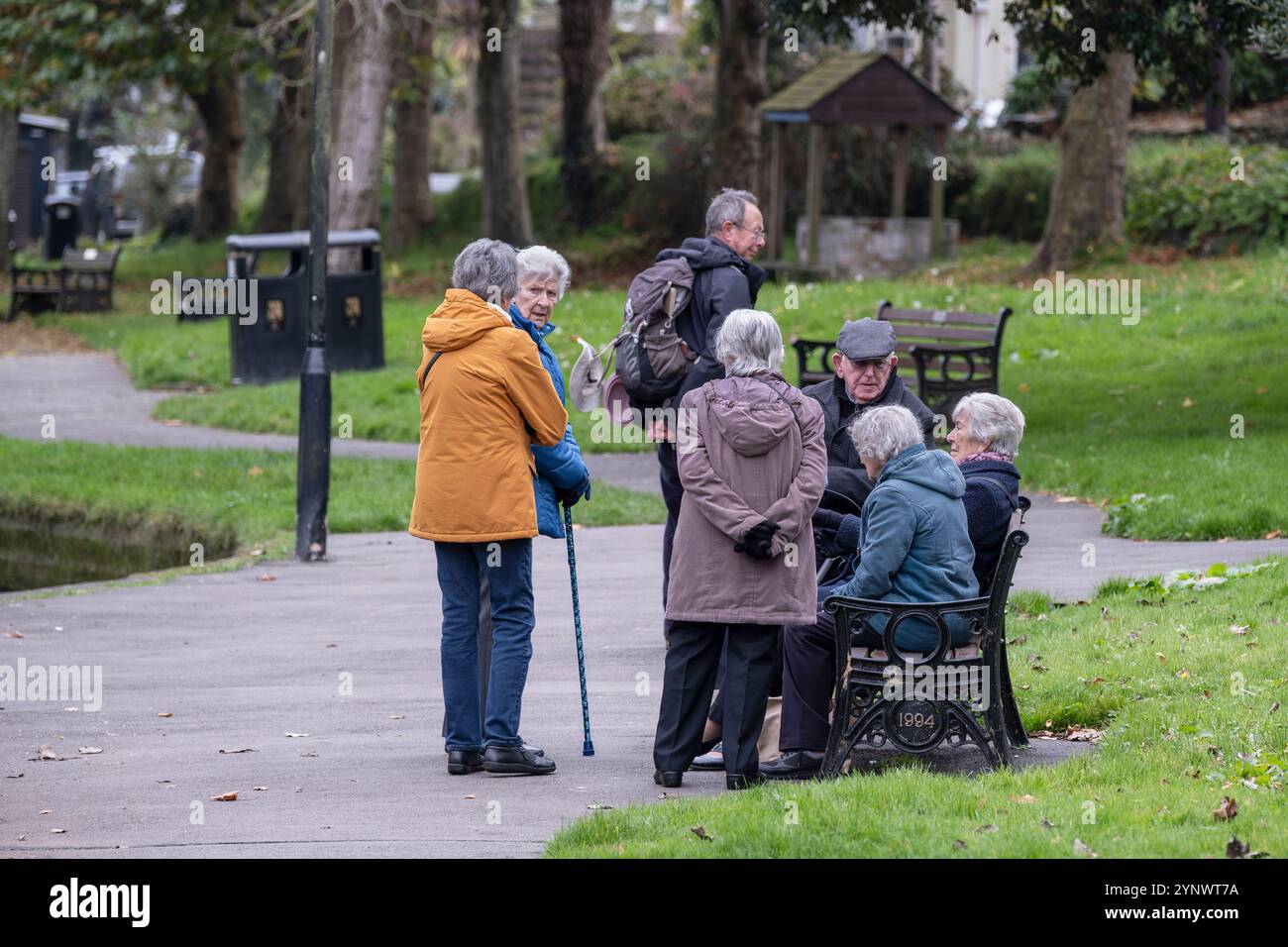 A group of elderly mature people meeting and chatting in Trenance ...