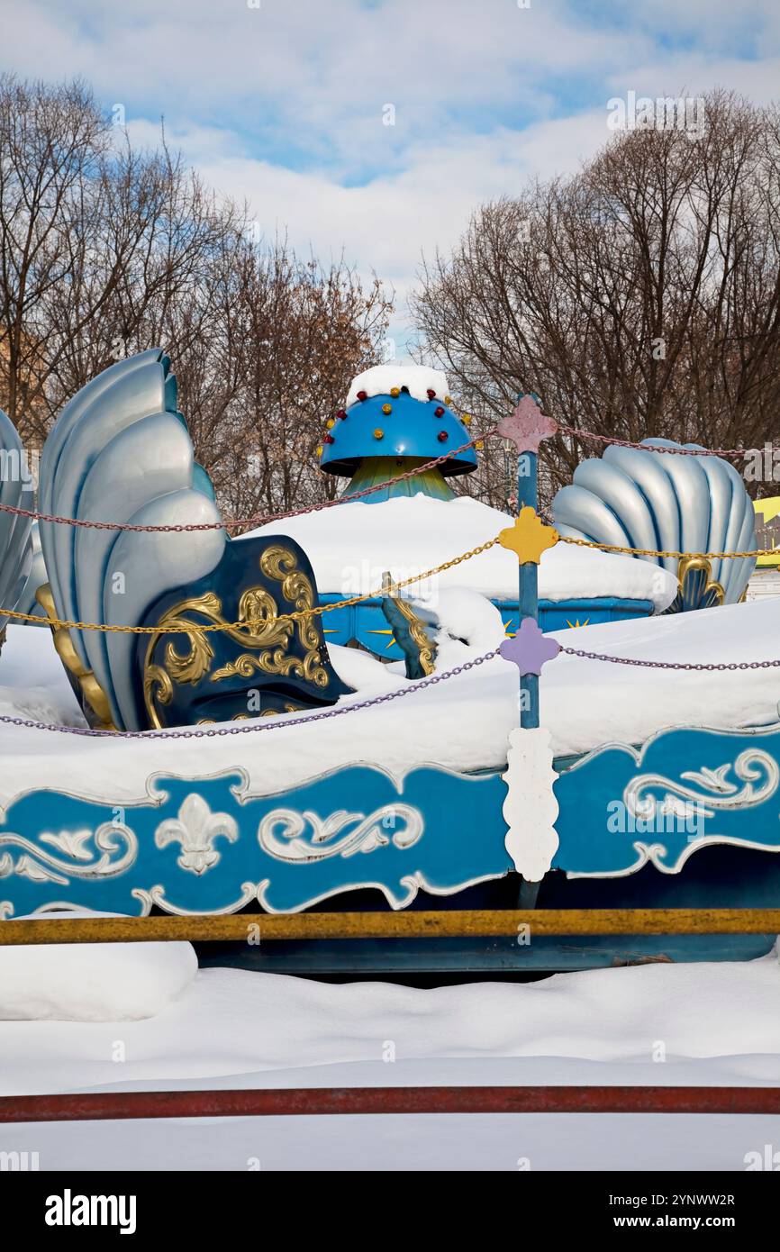 Playground in the winter with a merry-go-round under the snow Stock ...