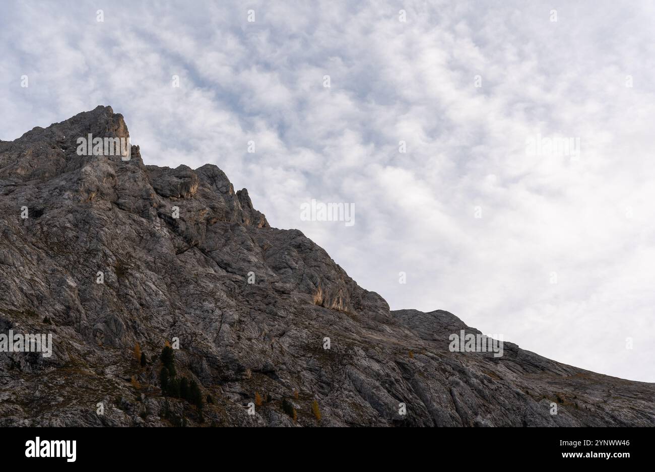 Textured clouds above rocky limestone peaks in the Italian Dolomites ...