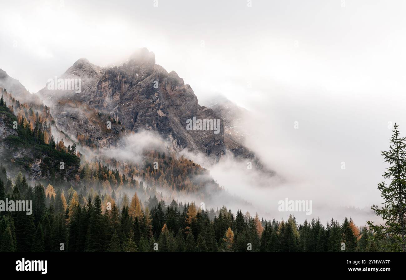 Beautiful dolomite landscape with low clouds and mountains near Canazei ...