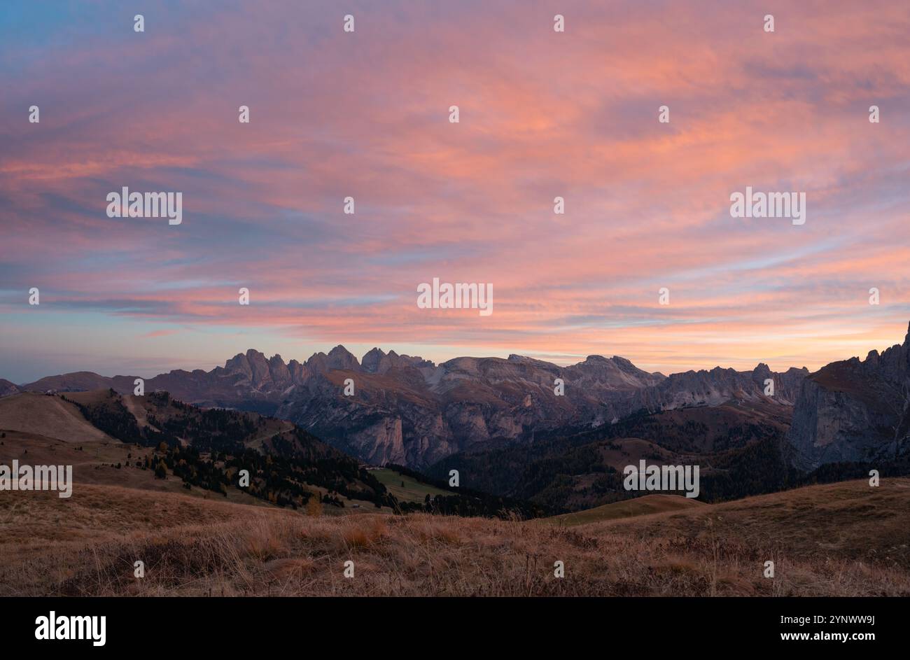 Amazing pink and orange sunrise light above an alpine landscape in the ...