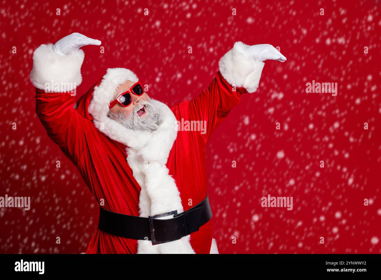Portrait of attractive cheerful thick Santa dancing having fun fooling ...