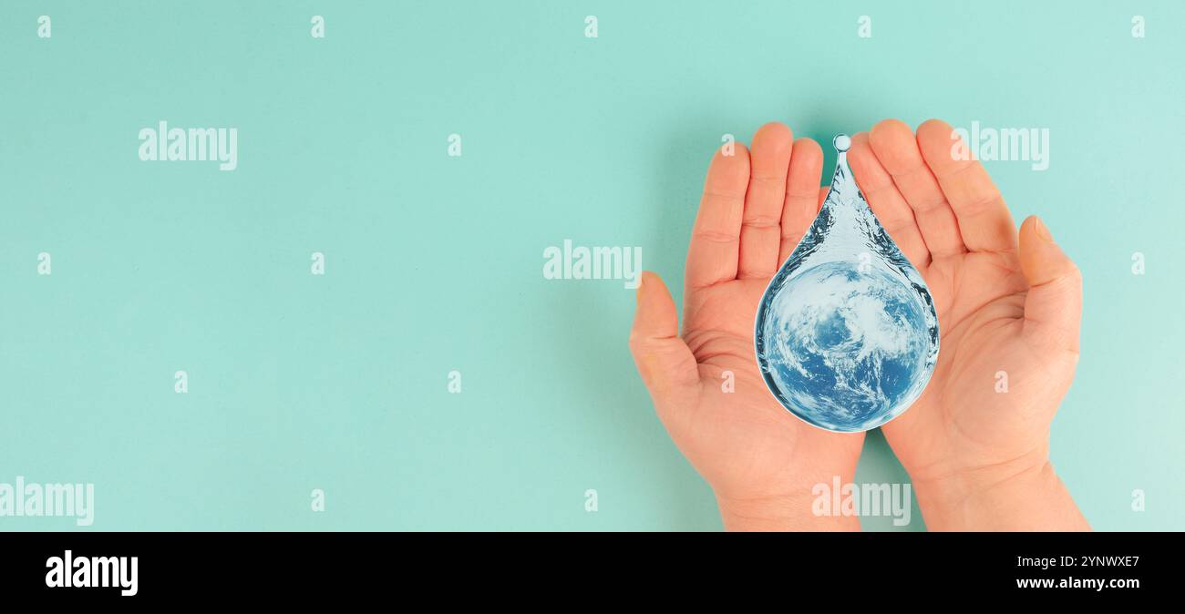 Hand holding water drop with planet earth, environment issue, scarcity ...