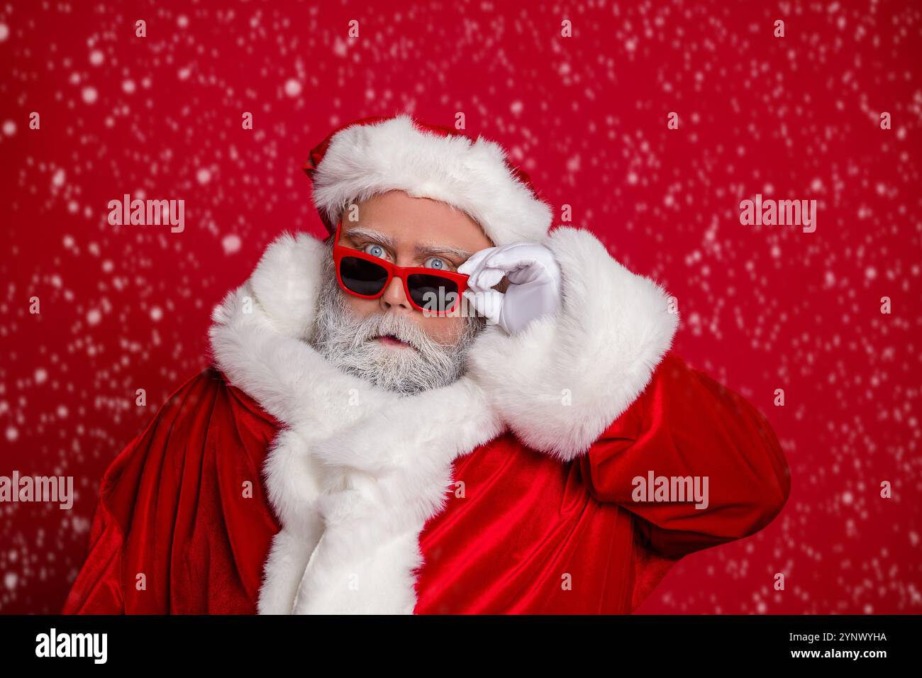 Portrait of attractive funny comic moody amazed stunned Santa touching ...