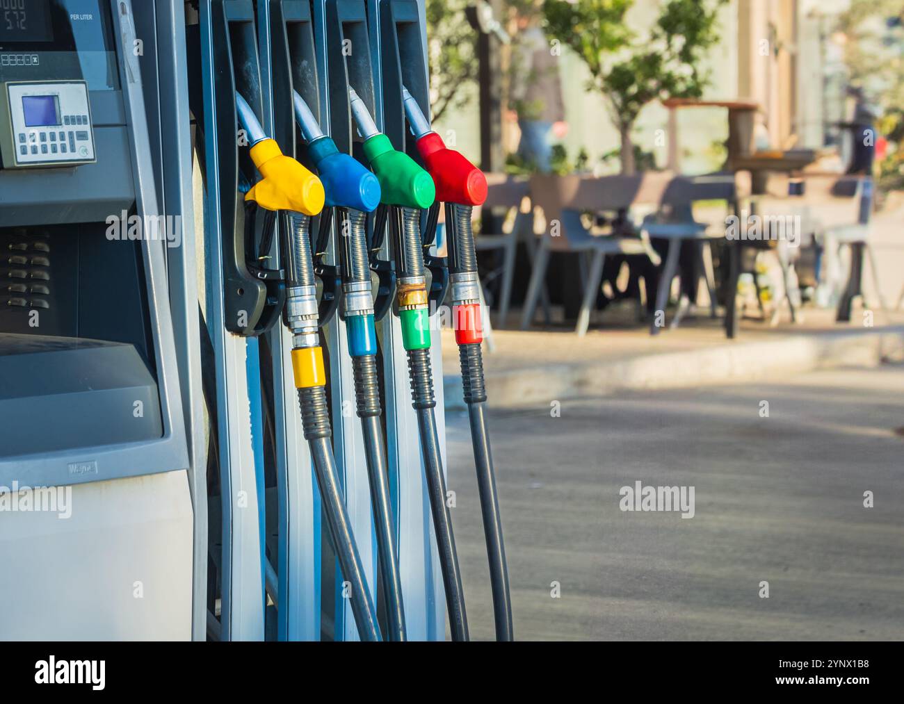 Colored Fuel nozzles at the petrol pump or gas station. Close up photo. Gas pump handle. Fuel ...