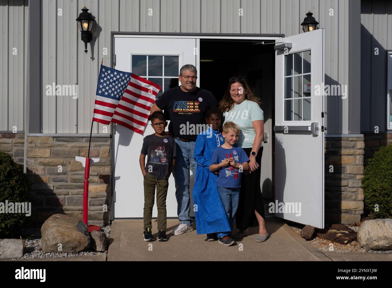 Mike and Erin Young and their three adopted kids from left, Lucas, 8 ...
