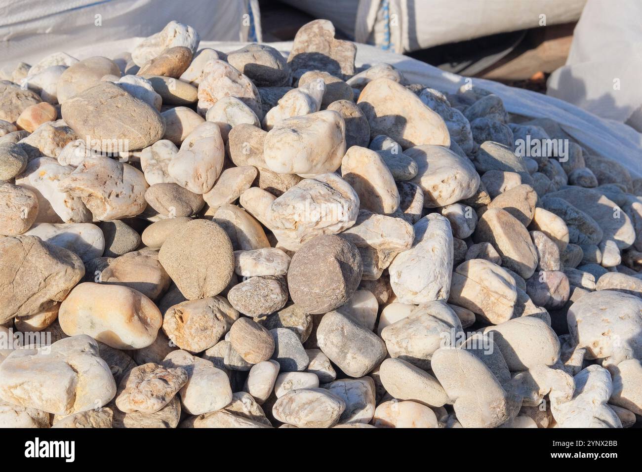 Decorative stones are sold in construction market. Materials pebbles ...