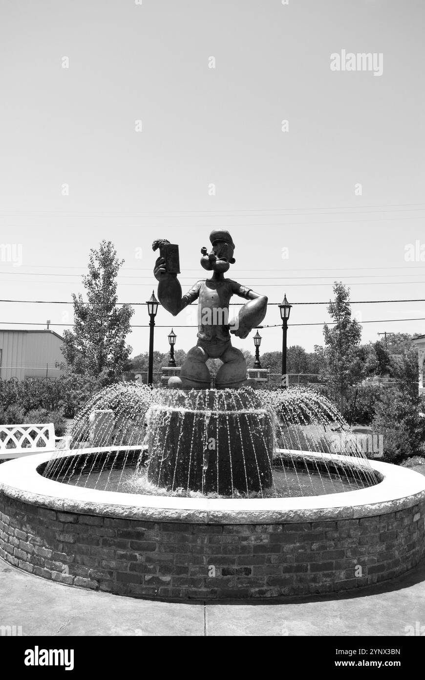 Statue of Popeye the Sailor Man standing beside a fountain in Alma ...