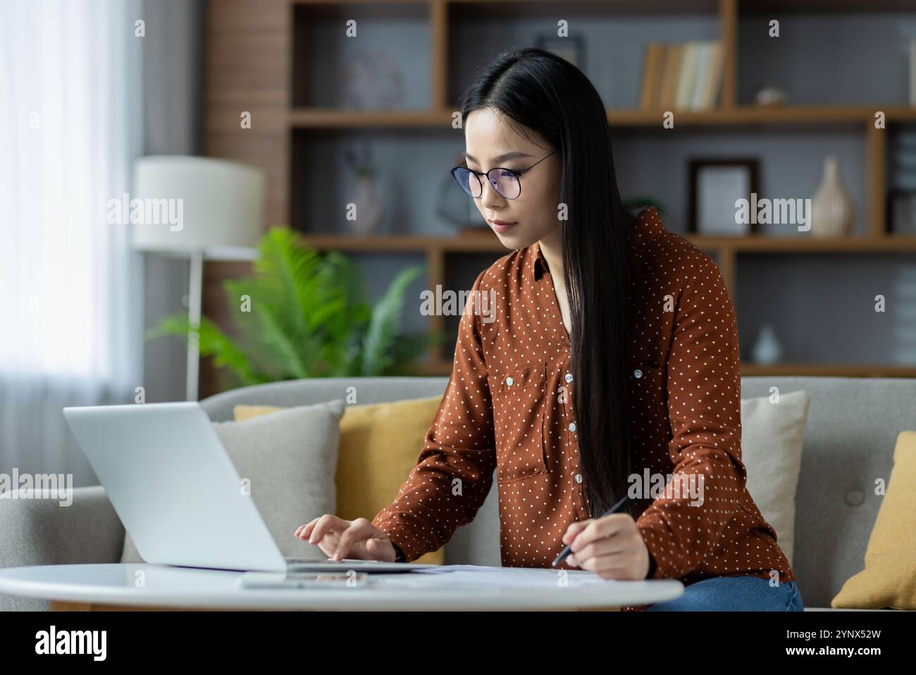 Woman working focused on laptop hi-res stock photography and images - Alamy
