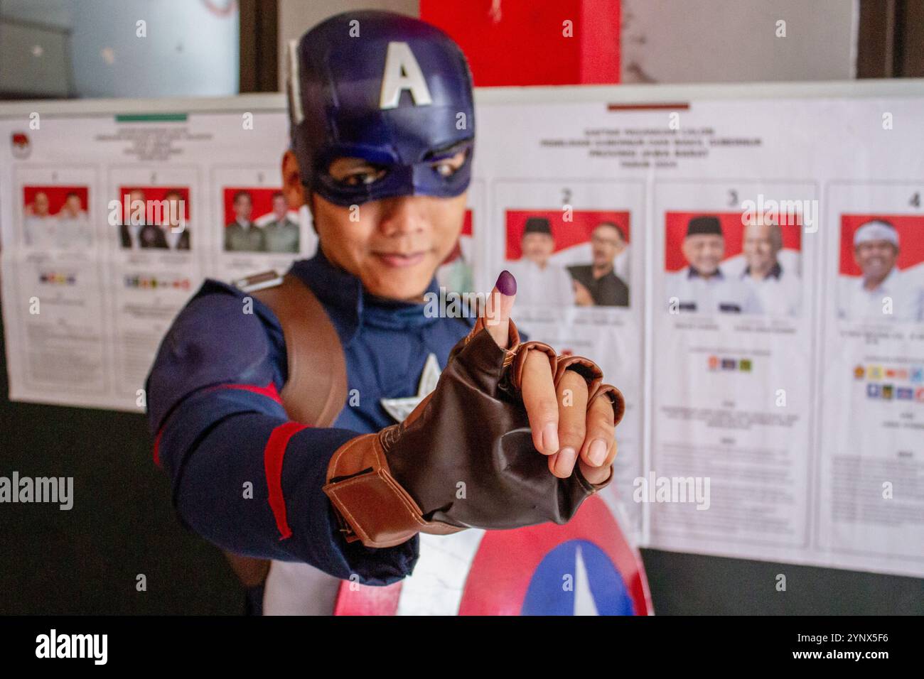 Cimahi, Indonesia. 27th Nov, 2024. A man wearing Captain America ...