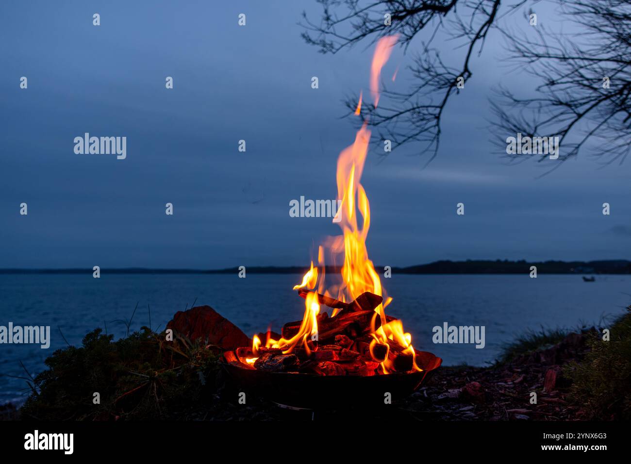 small campfire beside the sea in Cornwall Stock Photo - Alamy